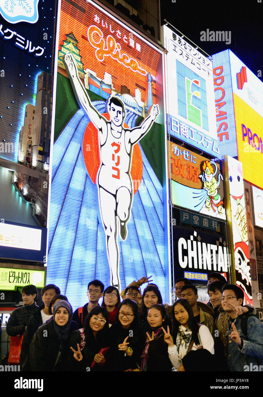 OSAKA, Japan - People pose for photos in Osaka's downtown Dotombori ...