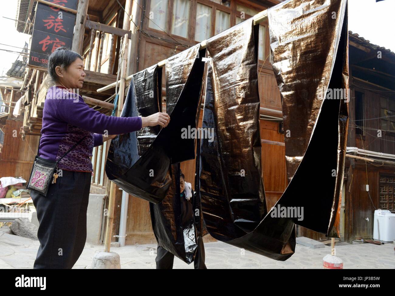 TOKYO, Japan - A woman of the Dong people's community in Liping county ...