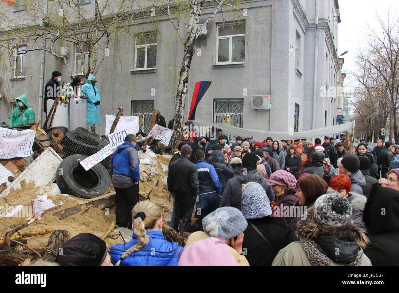 DONETSK, Ukraine - Pro-Russian residents gather in front of a police ...