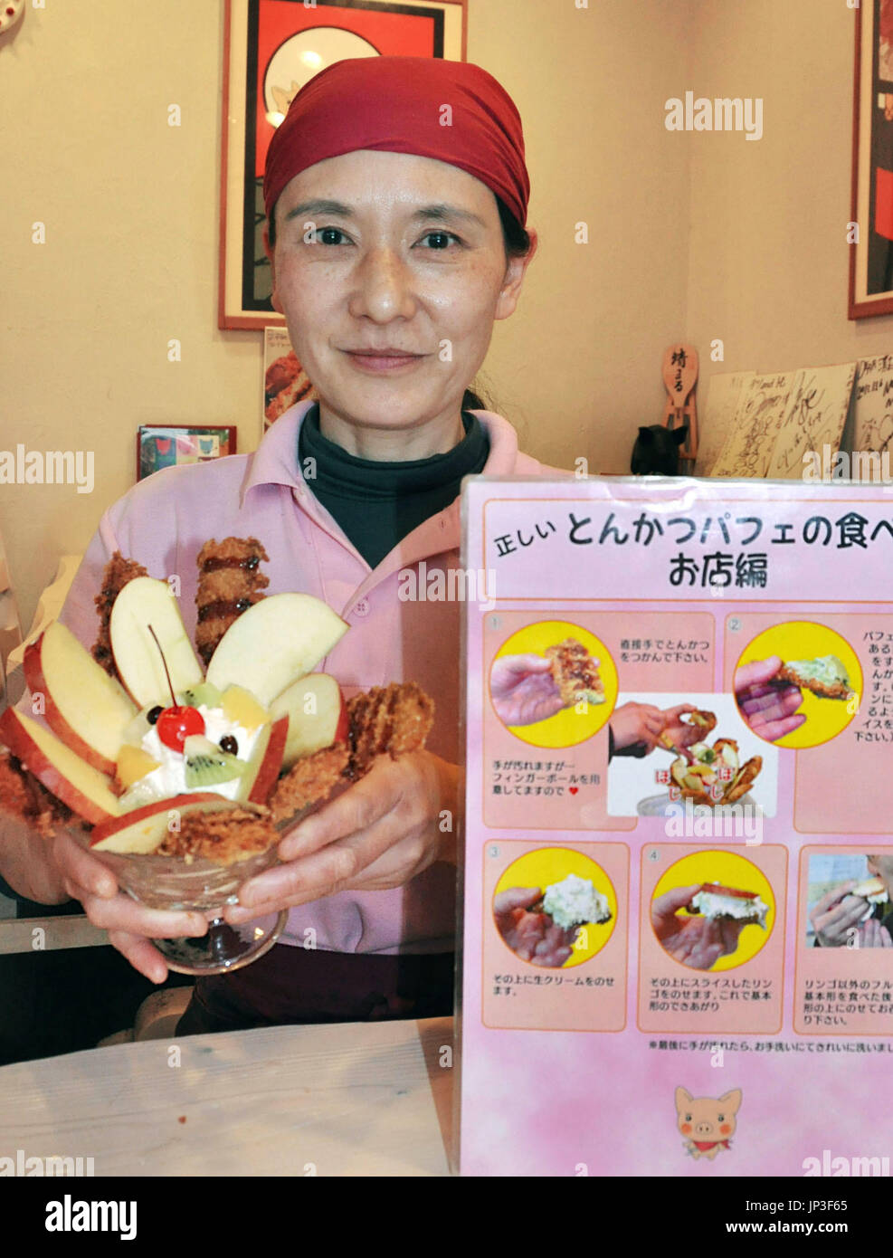MATSUYAMA, Japan - Cutlet shop operator Kiyoko Mizuno holds on April 11 ...