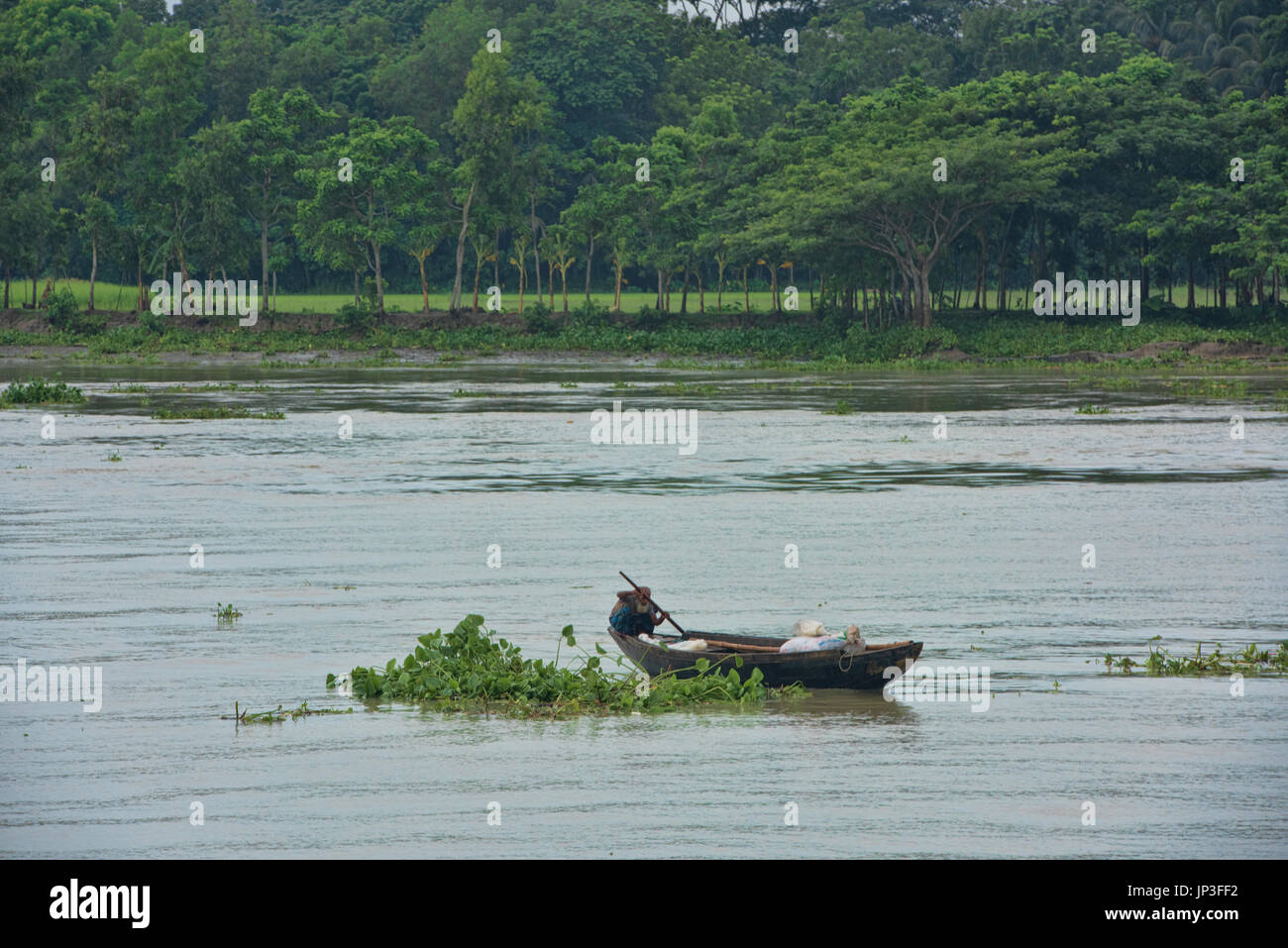 Boatman on the Kirtankhola River in the rain, Barisal, Bangladesh Stock ...