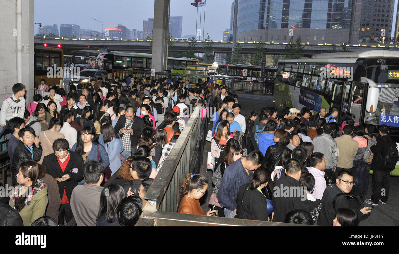 BEIJING, China - A bus station in Beijing is crowded with people ...