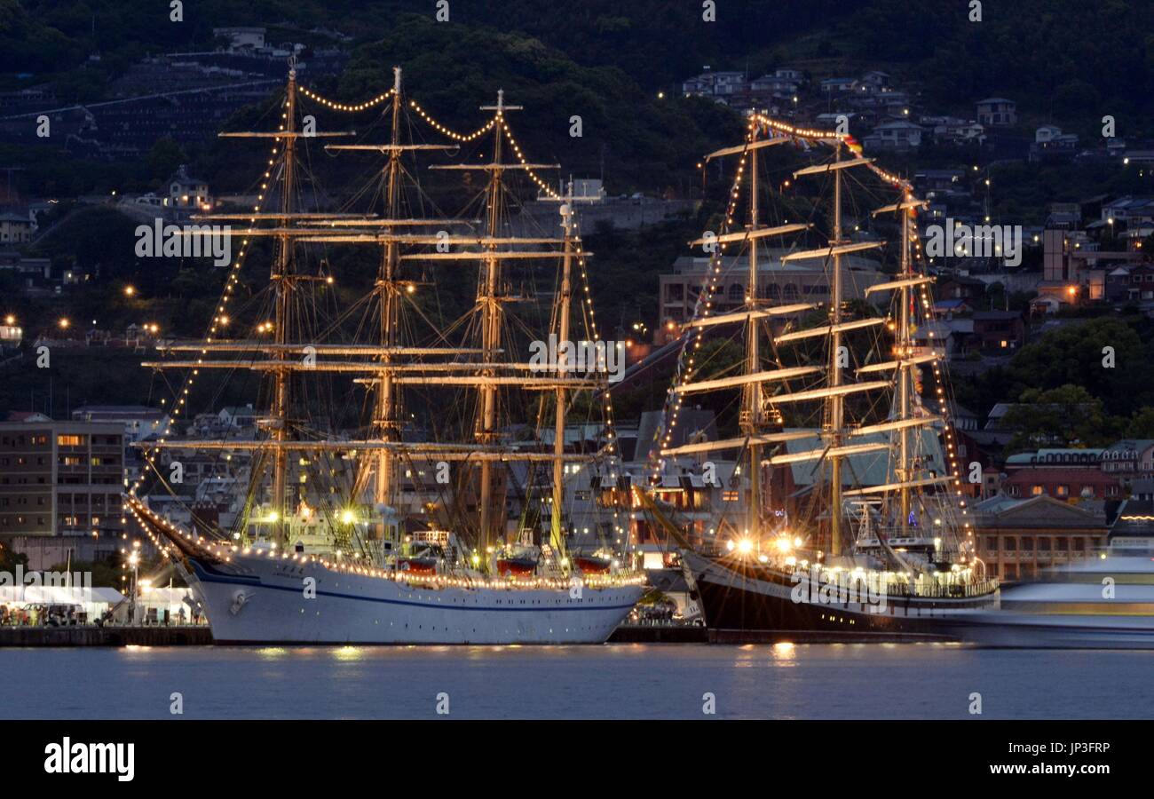 NAGASAKI, Japan - The Nippon Maru (L) and the Pallada from Russia are lit up at Nagasaki port ...