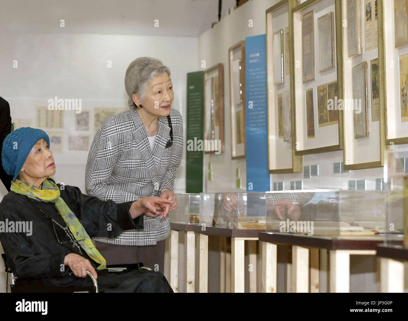 TOKYO, Japan - Empress Michiko (R) attends an exhibition of picture ...