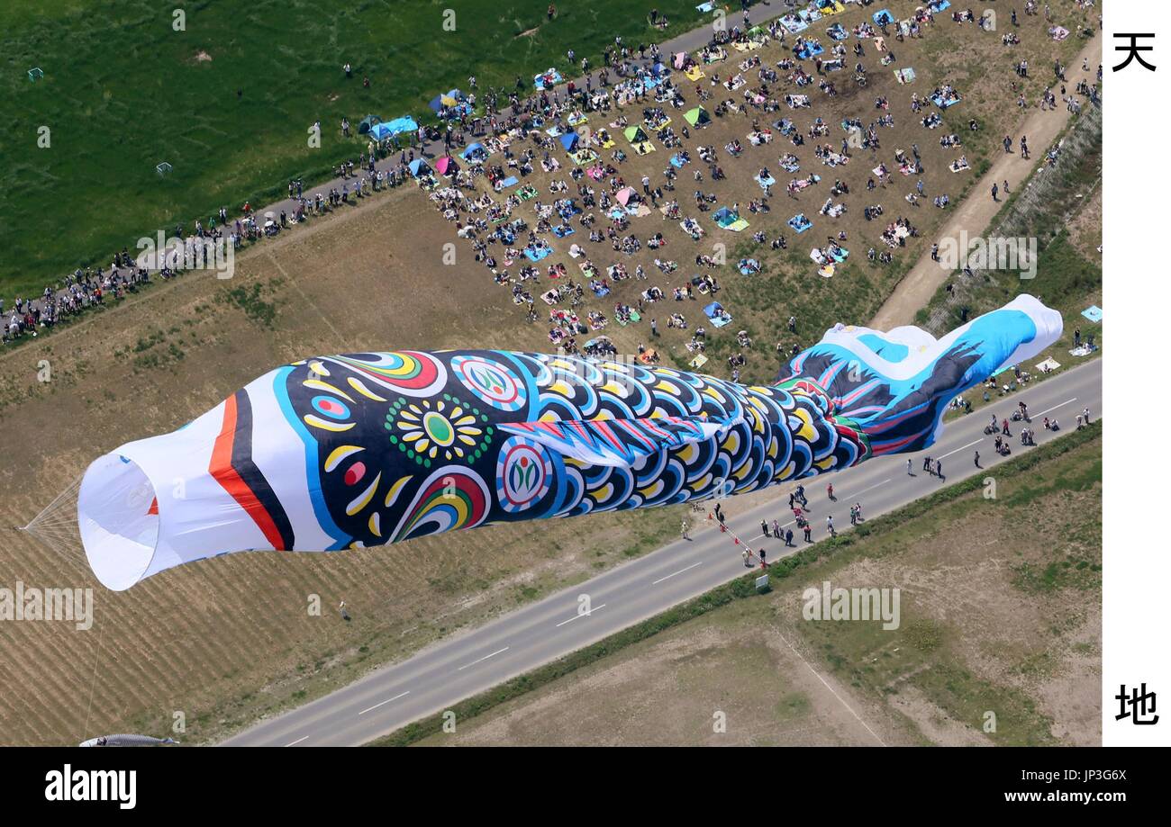 TOKYO, Japan - A 100-meter long carp streamer blows in the wind over ...