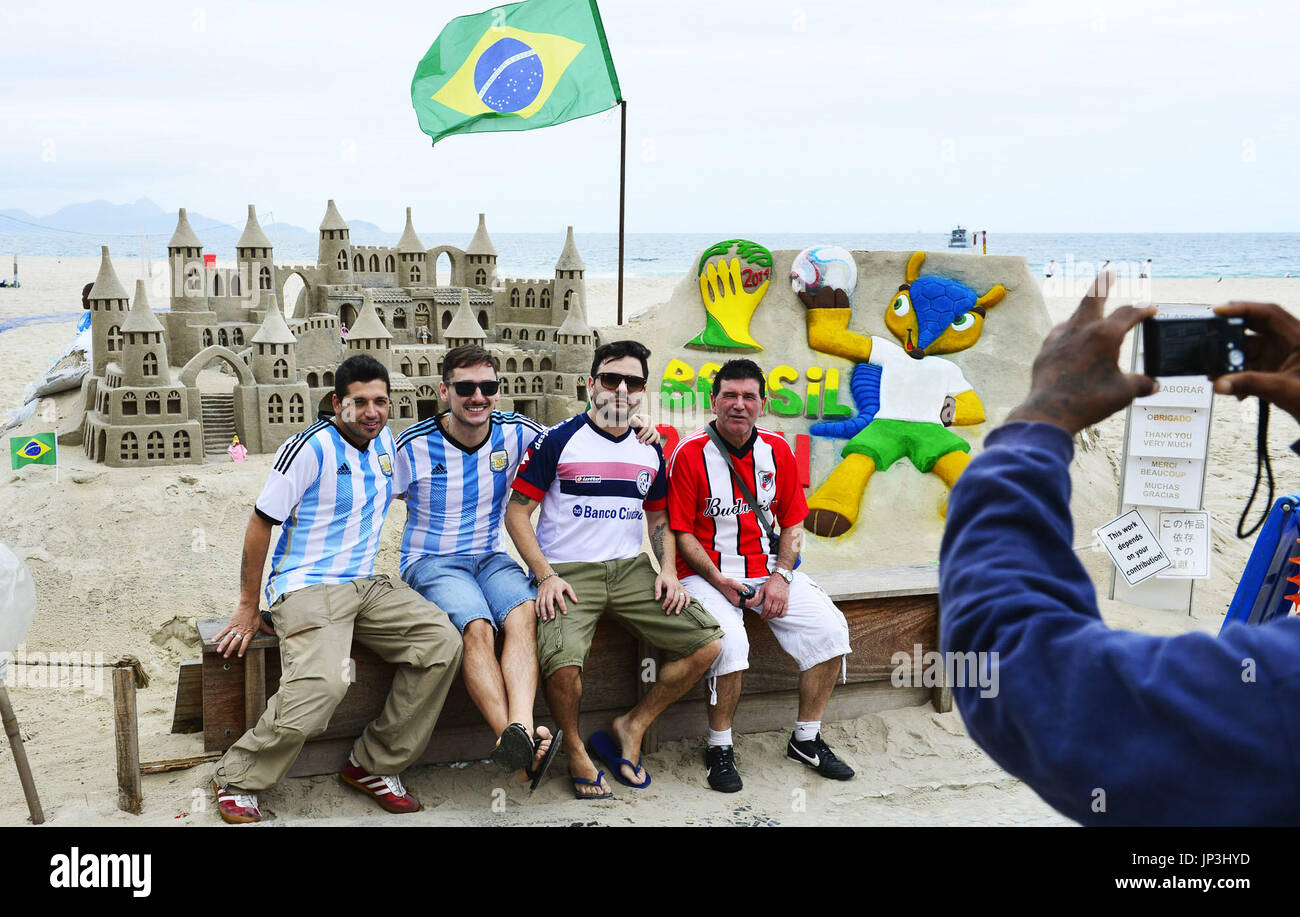 RIO DE JANEIRO, Brazil - Football fans pose for a photo in front of a ...