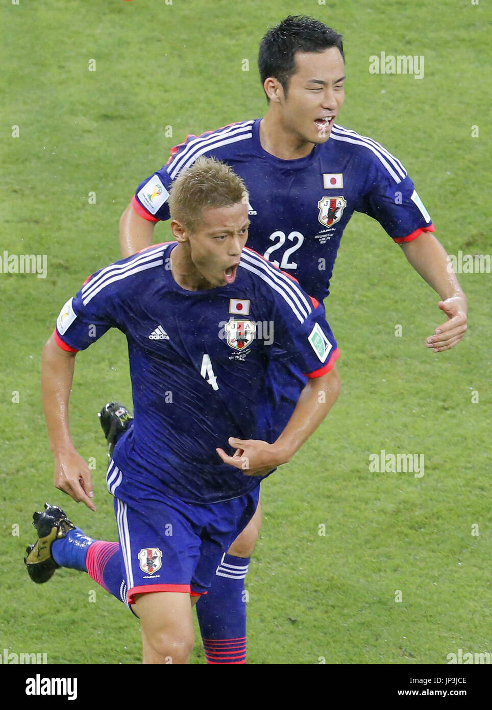 RECIFE, Brazil - Japan's Keisuke Honda (front) runs in celebration with ...