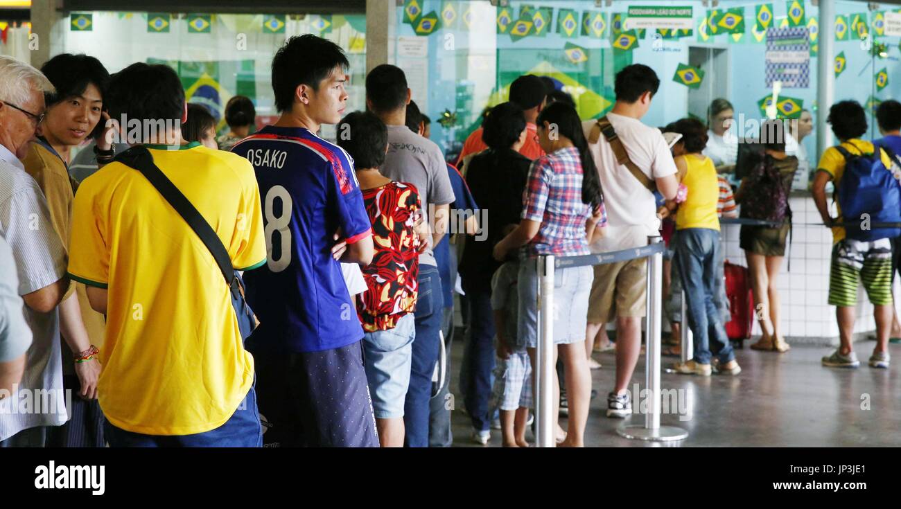 RECIFE, Brazil - Japanese soccer fans queue at a counter for long ...