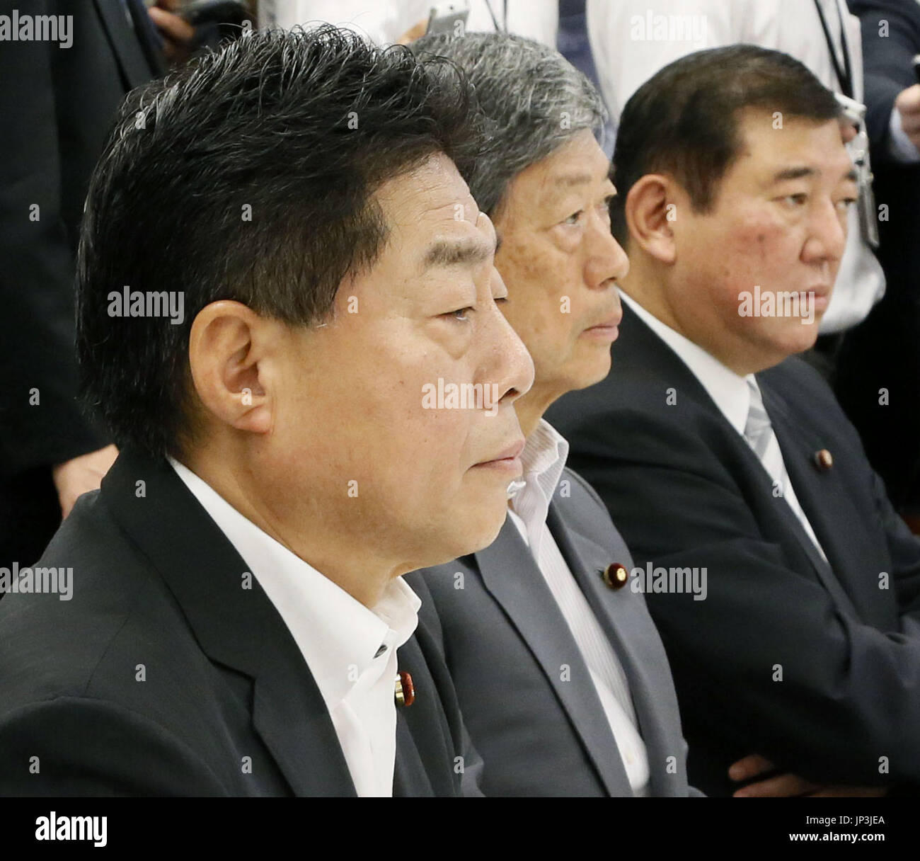 TOKYO, Japan - New Komeito party deputy chief Kazuo Kitagawa (L ...