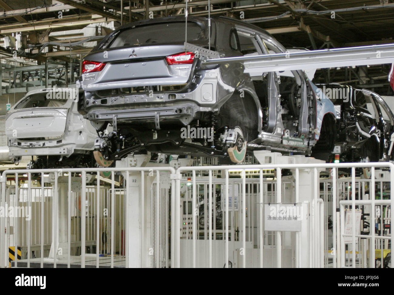 NAGOYA, Japan - Mitsubishi Motors Corp. shows the press a production ...