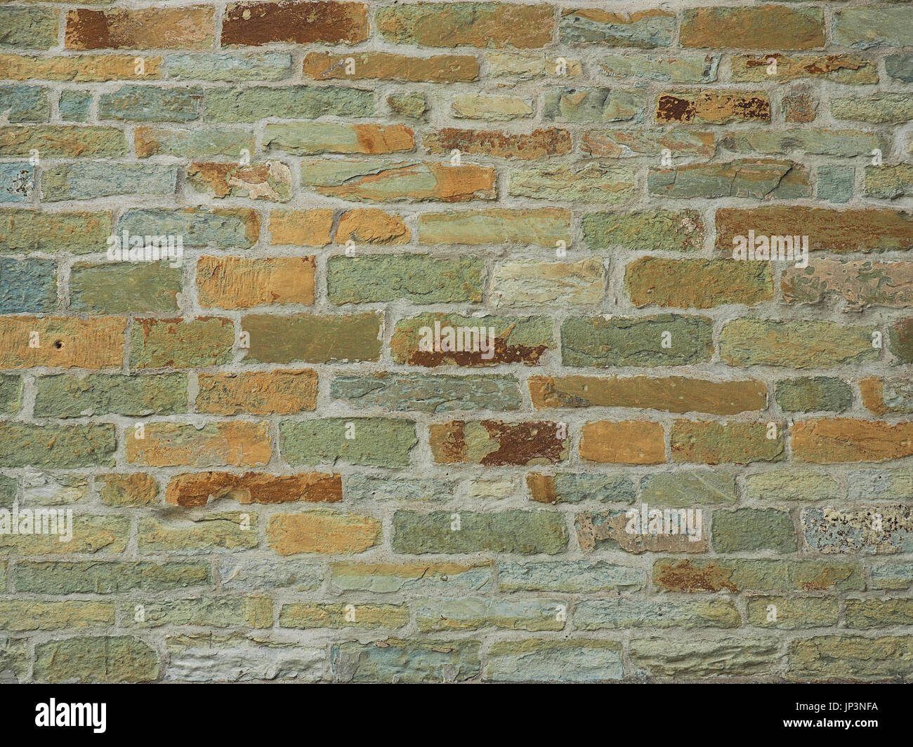 Old stone wall of a church using as background with space for text or ...