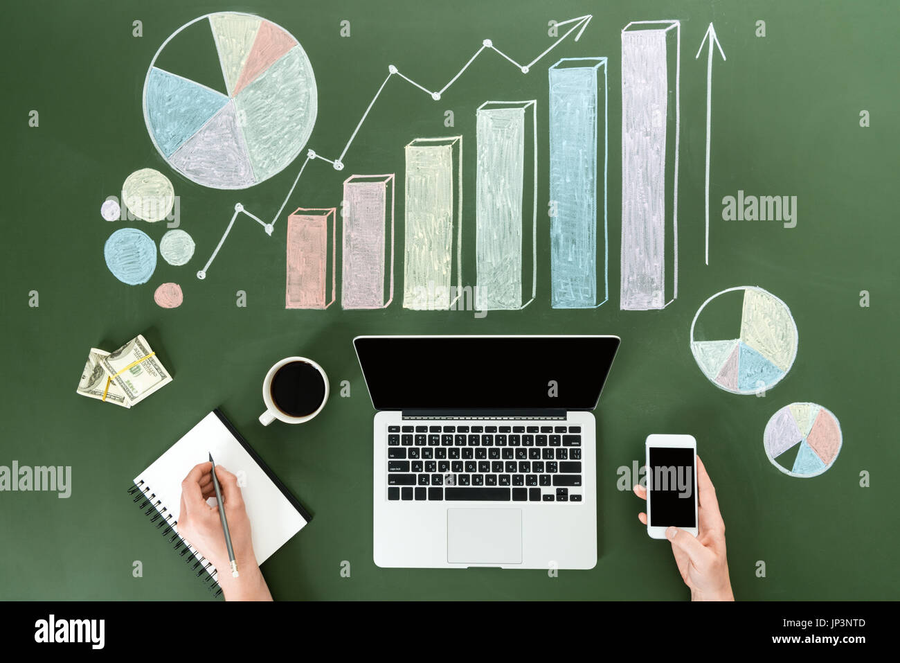 Top view of business person using digital devices at workplace with ...