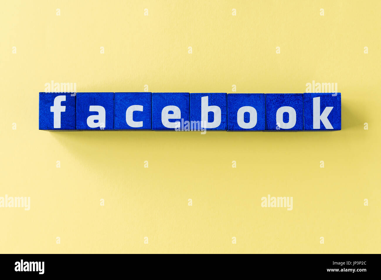 Word Facebook made from blue cubes on yellow surface Stock Photo - Alamy