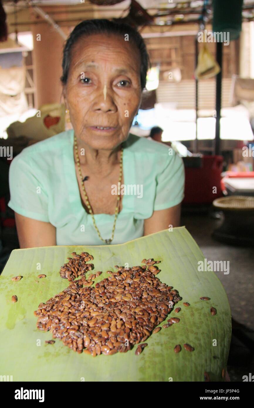 IMPHAL, India - A woman shows the traditional food "hawaijar ...