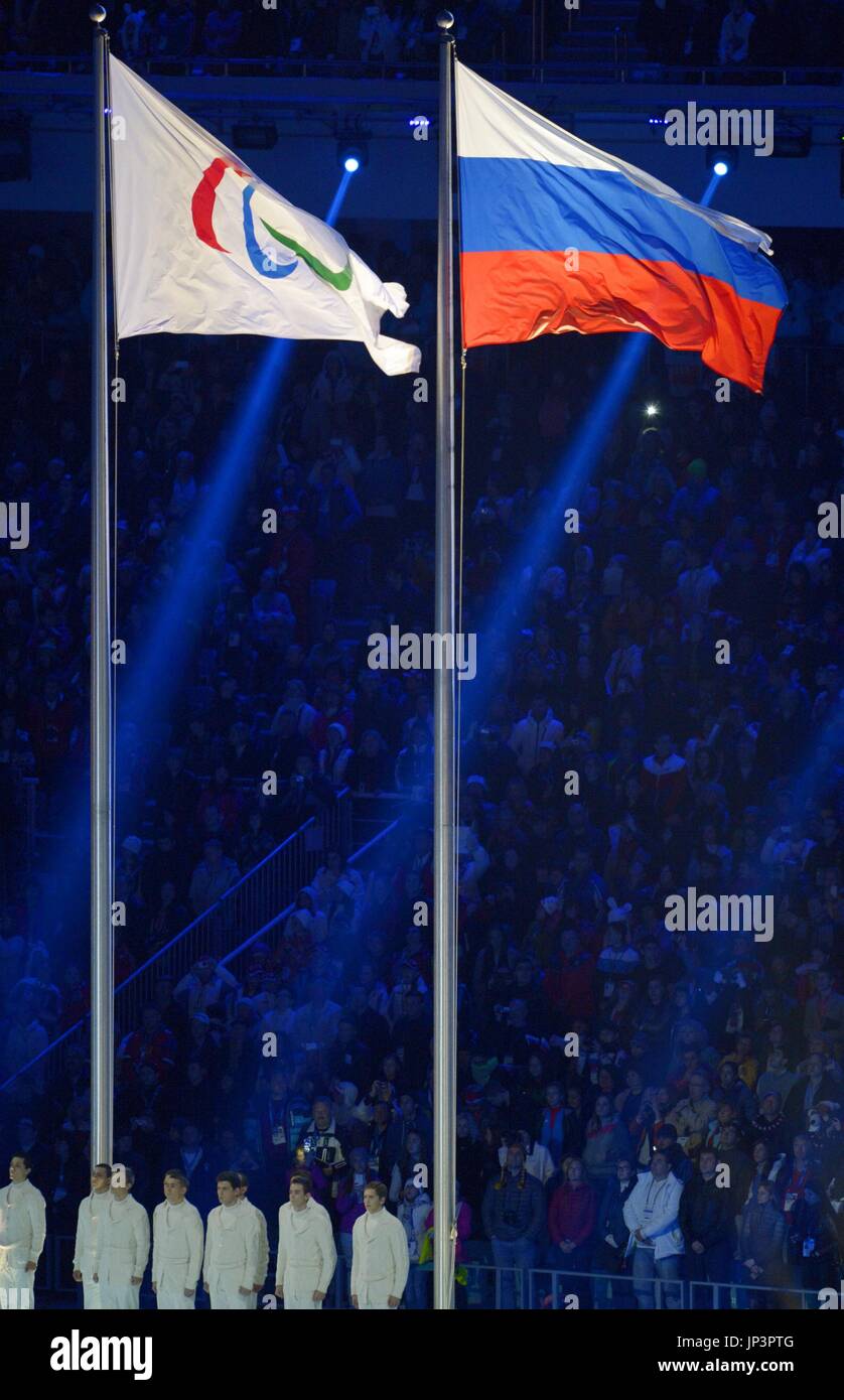 SOCHI, Russia - The Russian flag (R) and the Paralympic flag are ...
