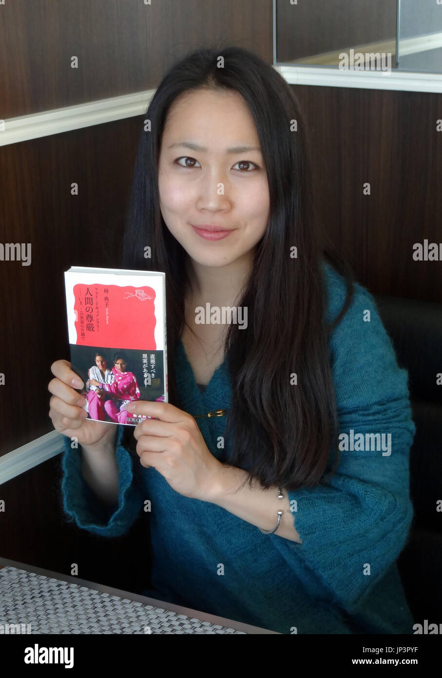 TOKYO, Japan - Freelance photographer Noriko Hayashi holds her newly ...