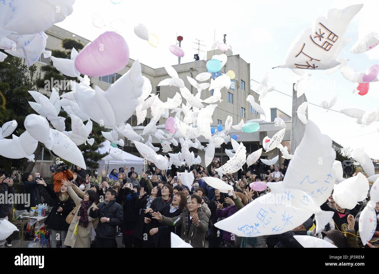 NATORI, Japan - People release dove-shaped balloons with messages ...