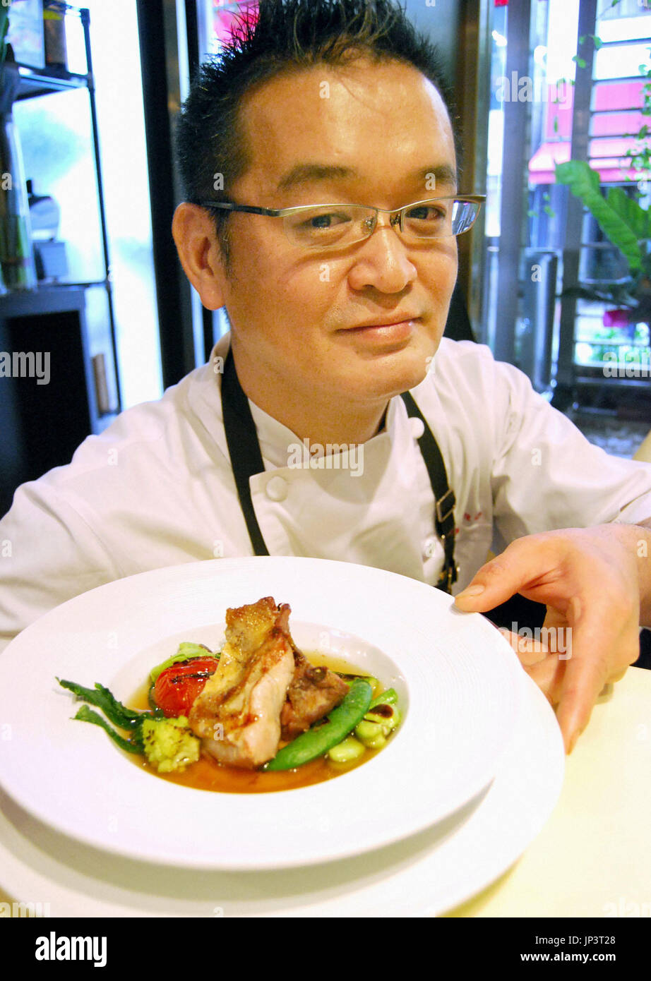 HIROSHIMA, Japan - Shigeto Nishitani, owner and chef of Italian ...