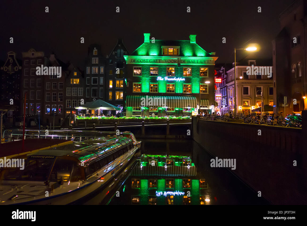 Colorful illuminated buildings in the city center of Amsterdam ...