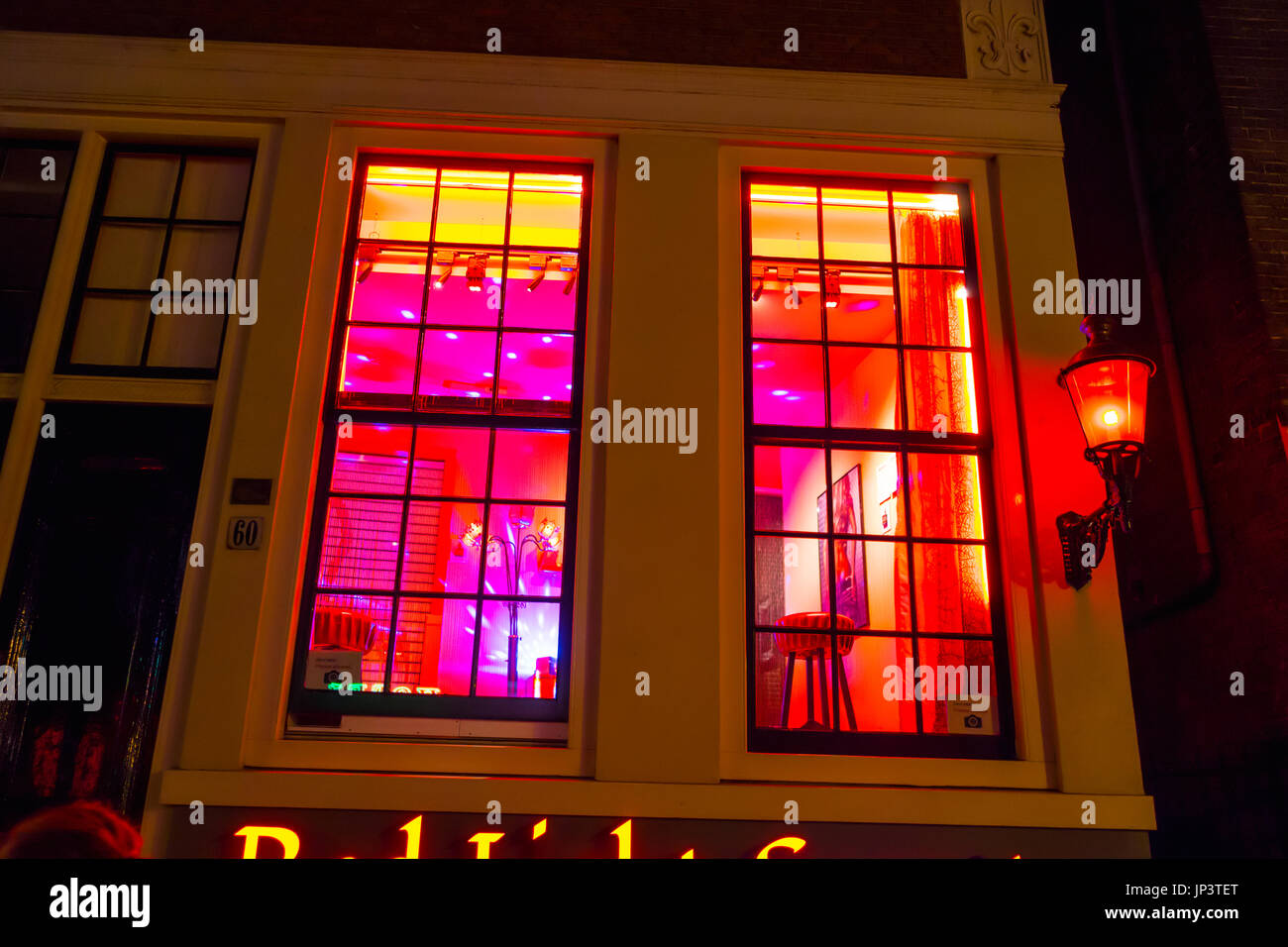 Typical red colored rooms in the Red Light district of Amsterdam ...