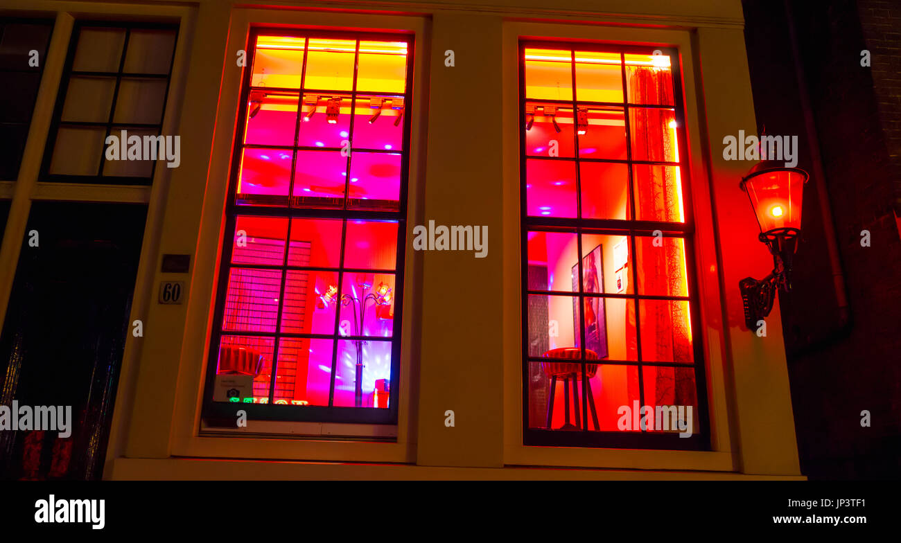 Typical red colored rooms in the Red Light district of Amsterdam ...