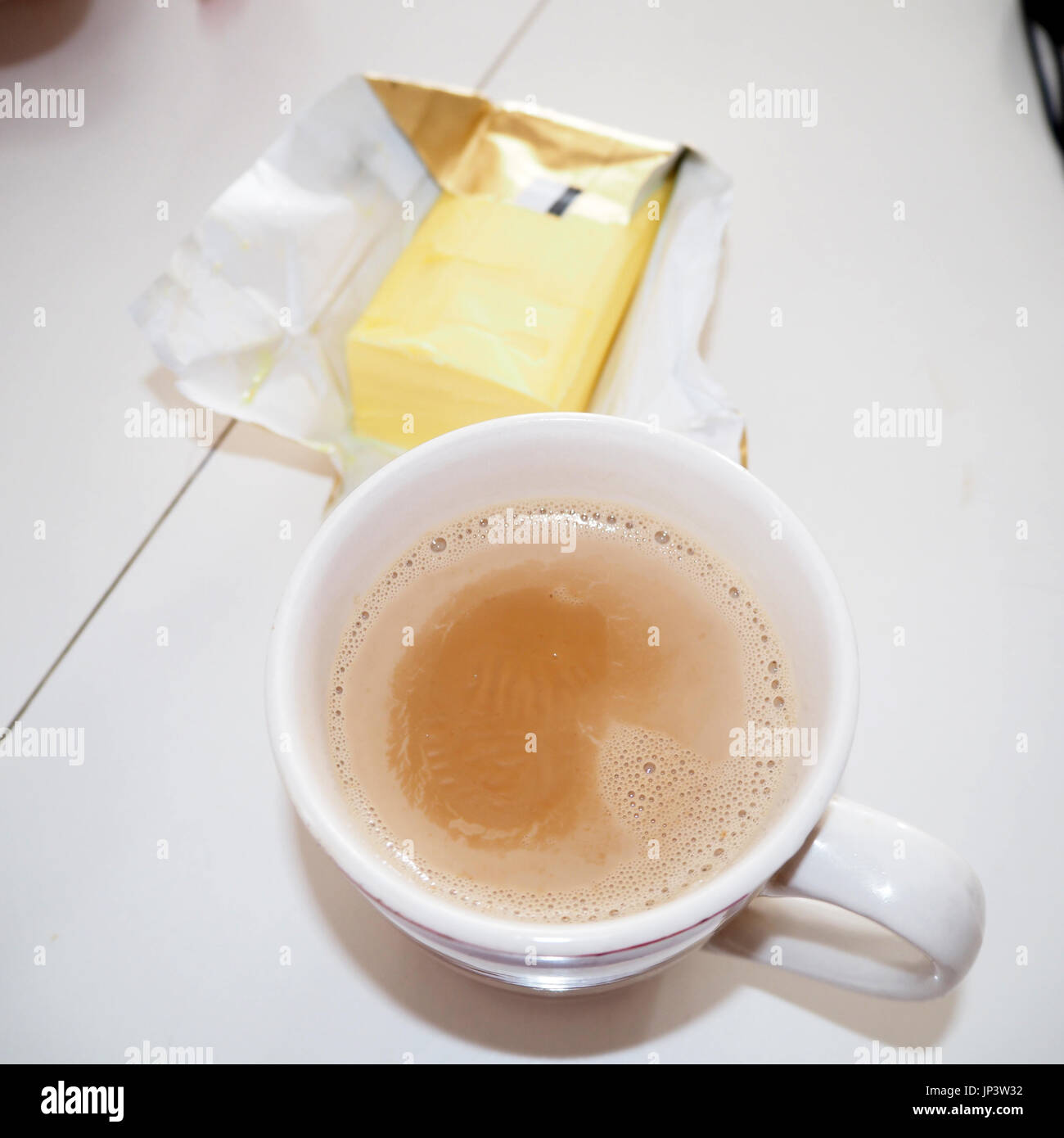 Skin on top of milky coffee Stock Photo - Alamy