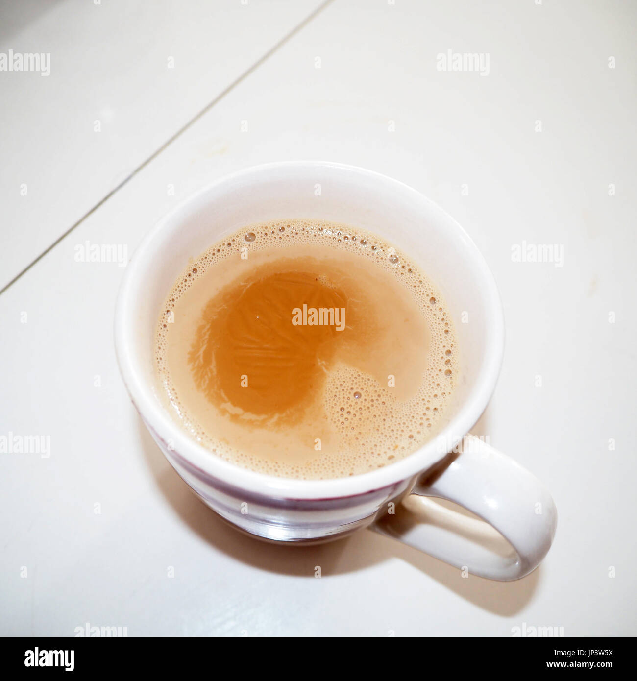 Skin on top of milky coffee Stock Photo - Alamy