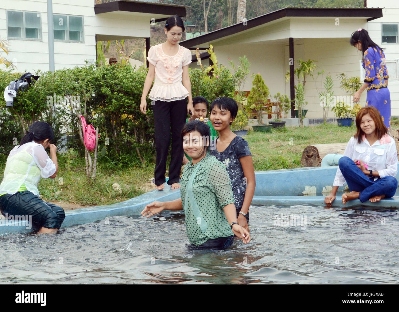 NAYPYIDAW, Myanmar - People relax in a hot spring in the suburbs of ...