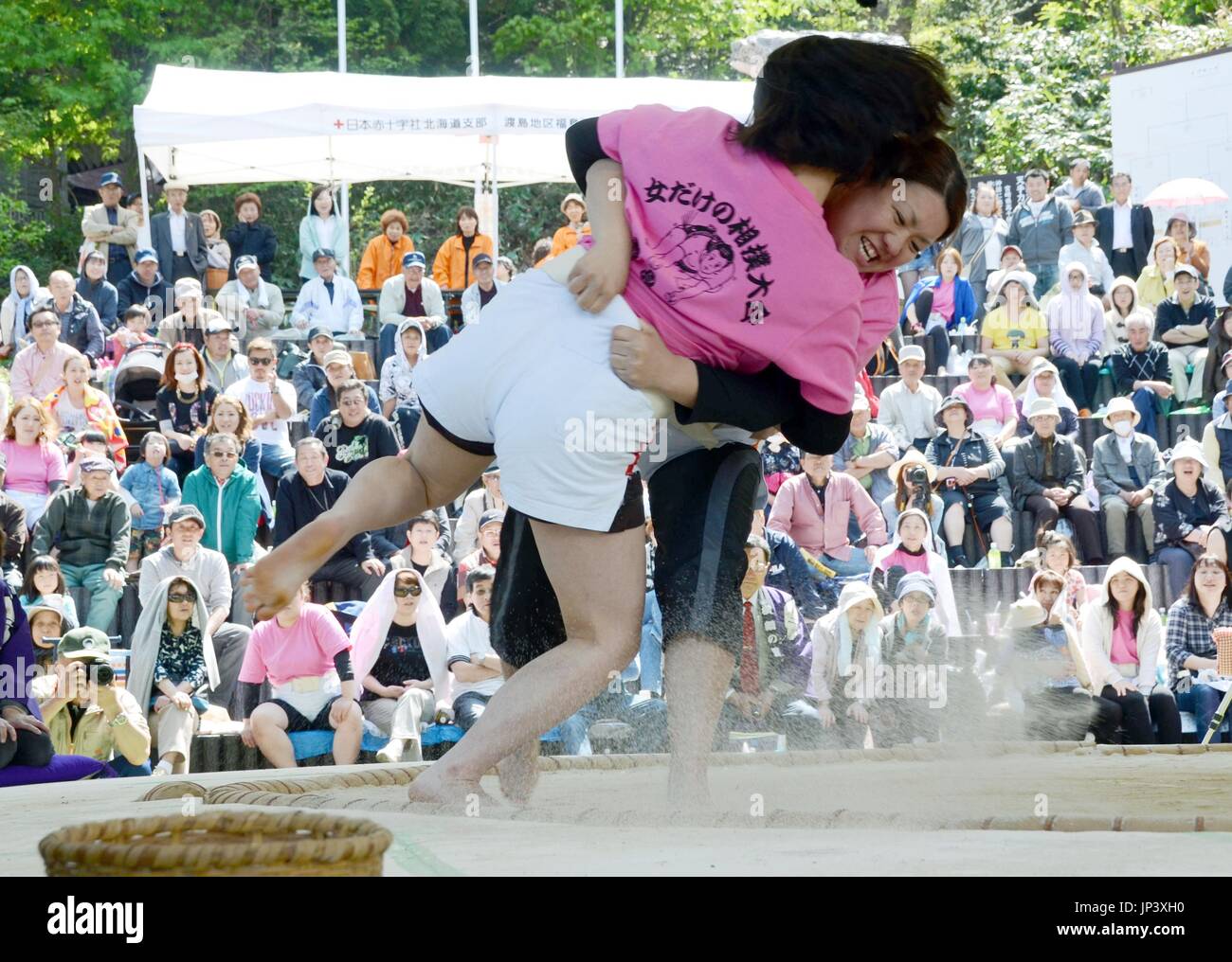 HAKODATE, Japan - Female sumo wrestlers engage in a match at a sumo ...