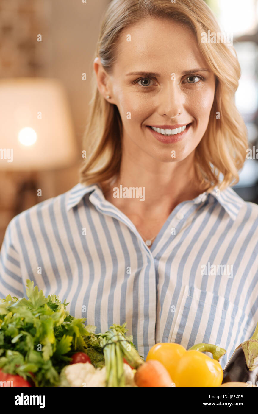 Cheerful classy lady loving fresh vegetables Stock Photo - Alamy