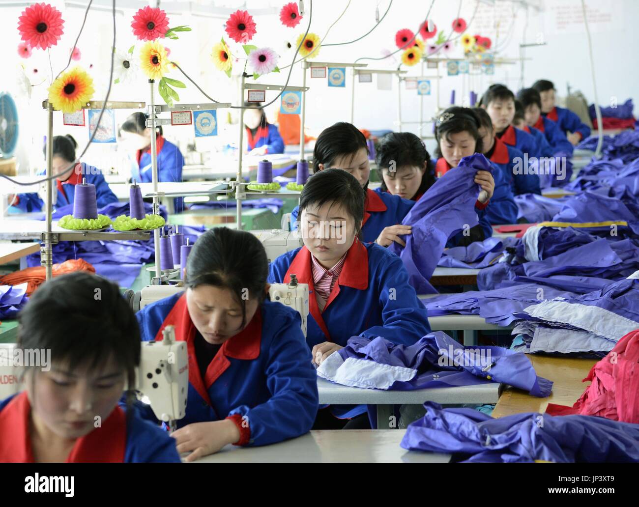 TOKYO, Japan - Employees seen at work in the Sonbong garment factory in ...