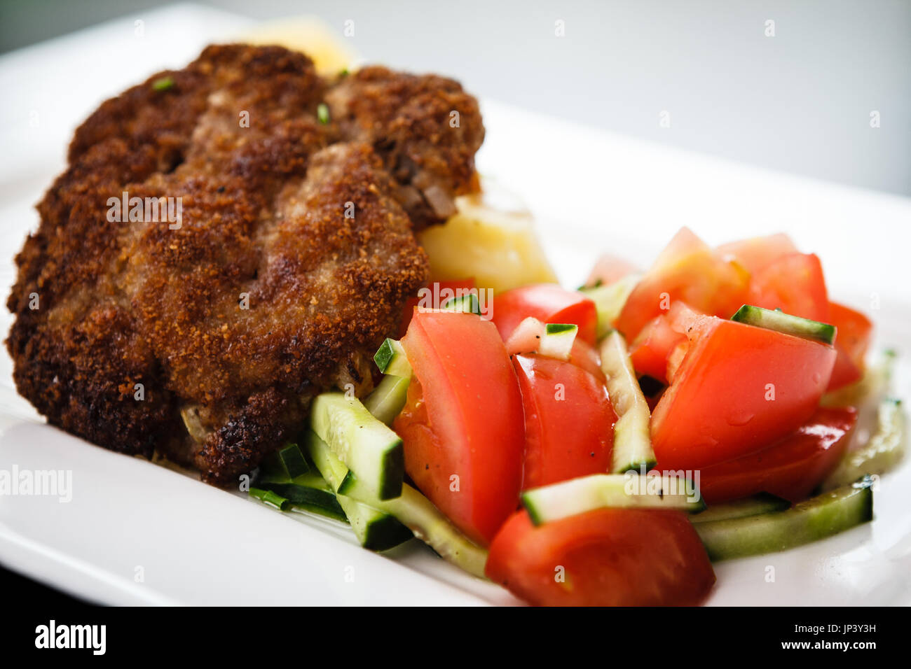 Cutlet with vegetables Stock Photo - Alamy