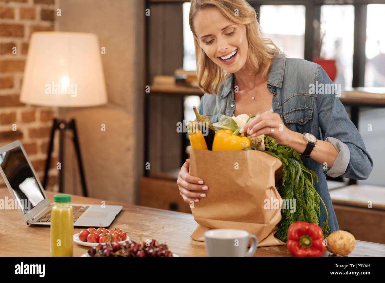 Productive diligent lady choosing ingredients for the recipe Stock ...