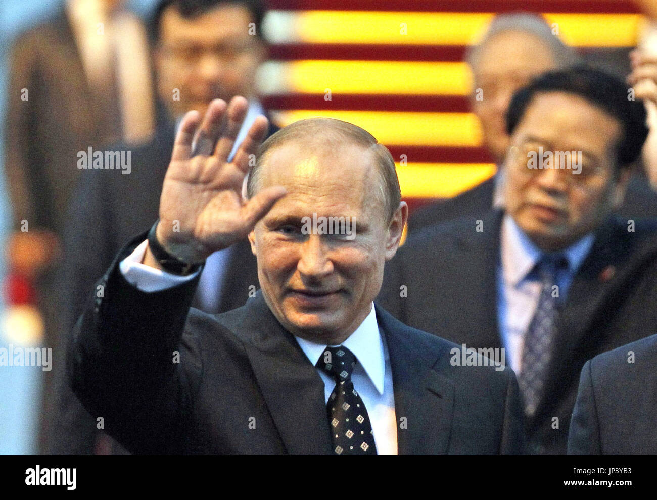 SHANGHAI, China - Russian President Vladimir Putin waves after arriving ...