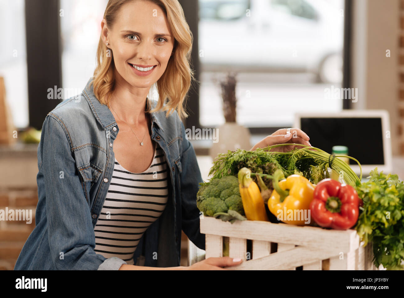 Storing food in kitchen woman hi-res stock photography and images - Alamy