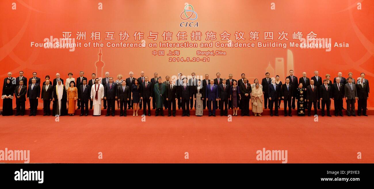 SHANGHAI, China - Participants pose during a photo session at the ...