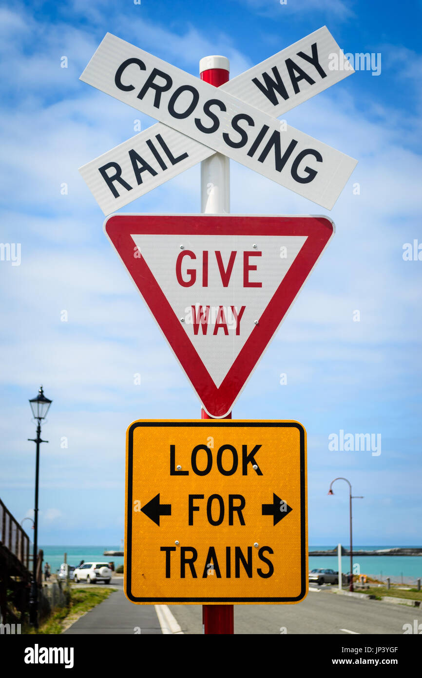 Railway crossing, Give way, Look for trains sign Stock Photo - Alamy