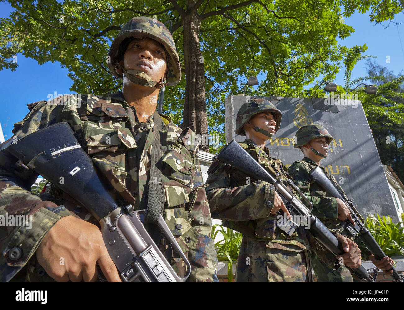 BANGKOK, Thailand - Thai soldiers stand guard in front of a military ...