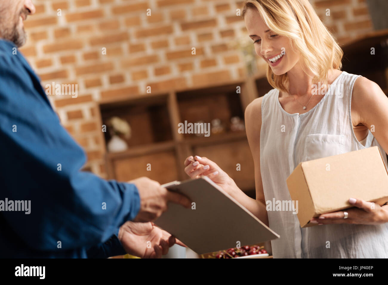 Consumer receiving hi-res stock photography and images - Alamy