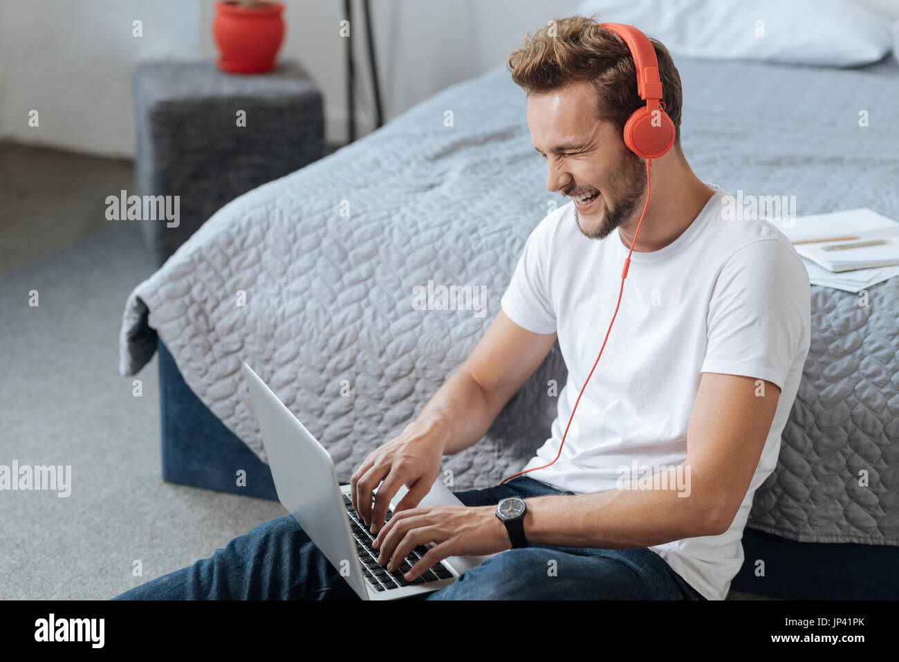 Smiling player enjoying the process of game Stock Photo - Alamy