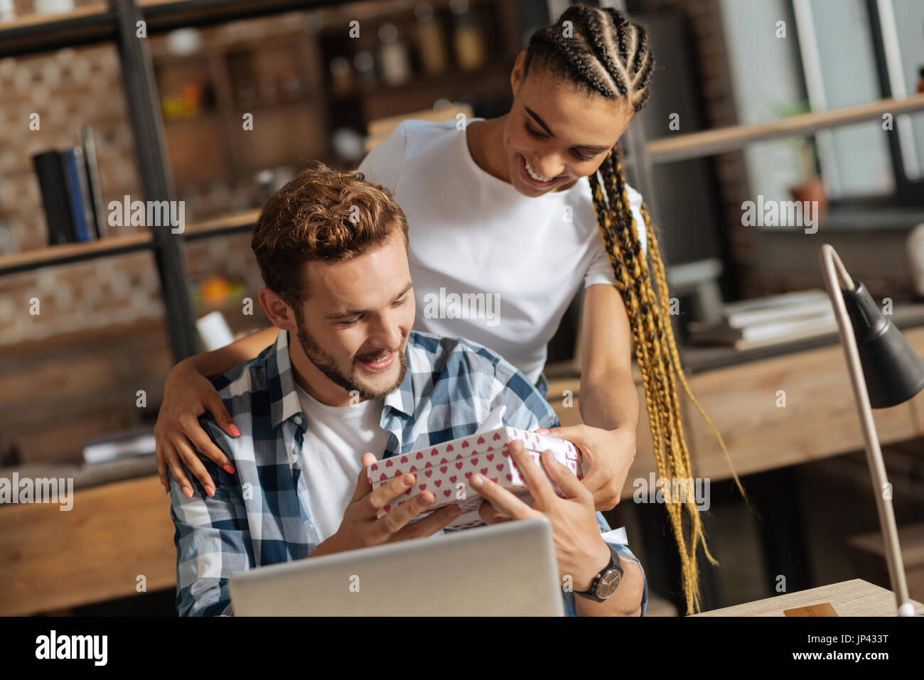 Surprised young man being pleased of present Stock Photo - Alamy
