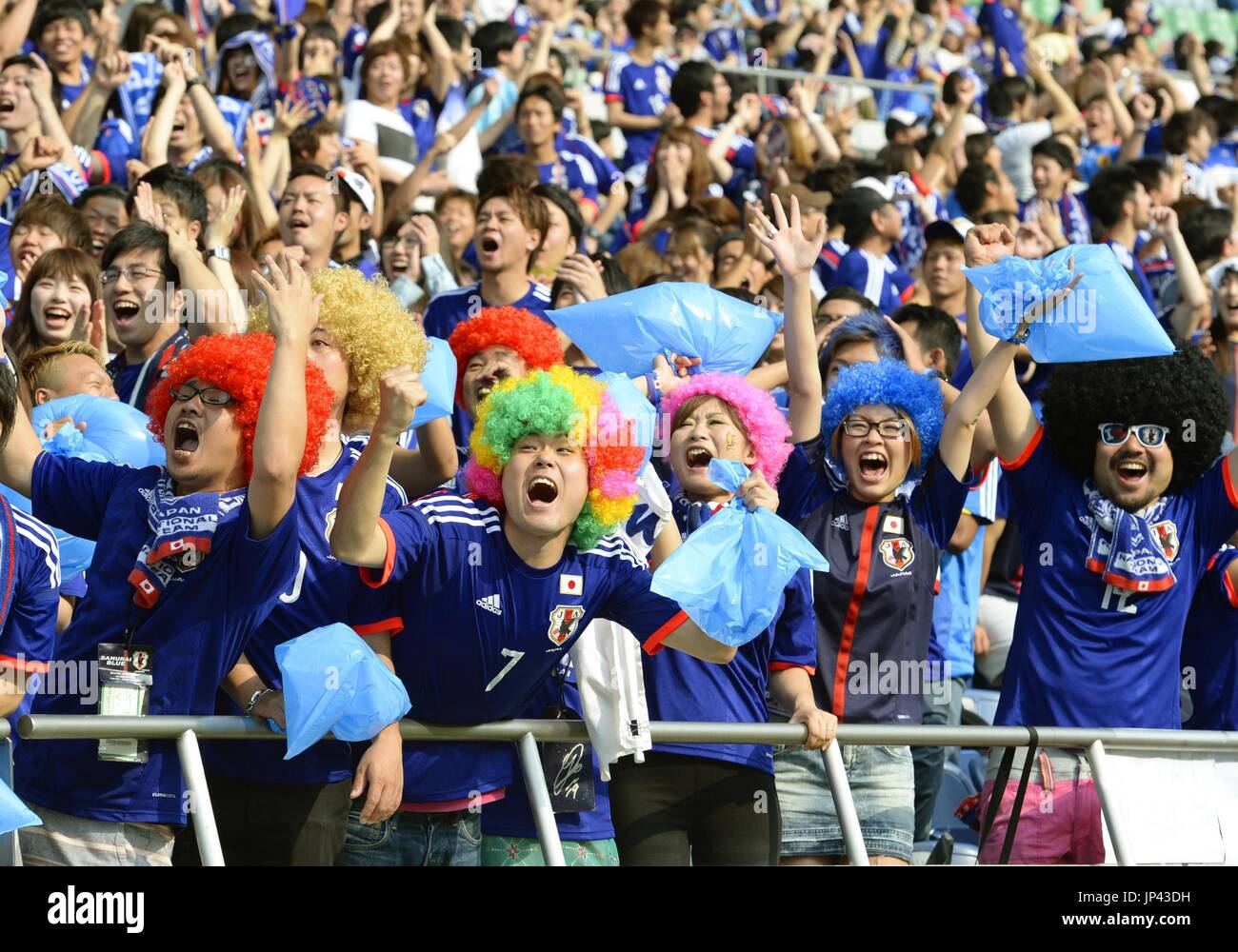 SAITAMA, Japan - Japan supporters cheer at Saitama Stadium in the city ...