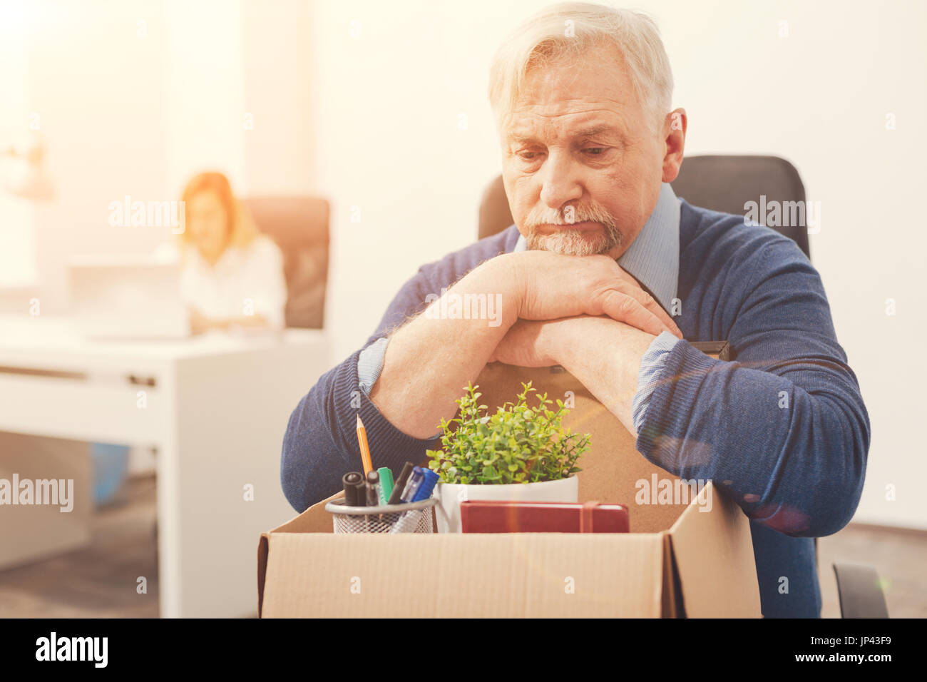 Sad thoughtful gentleman missing his job Stock Photo - Alamy