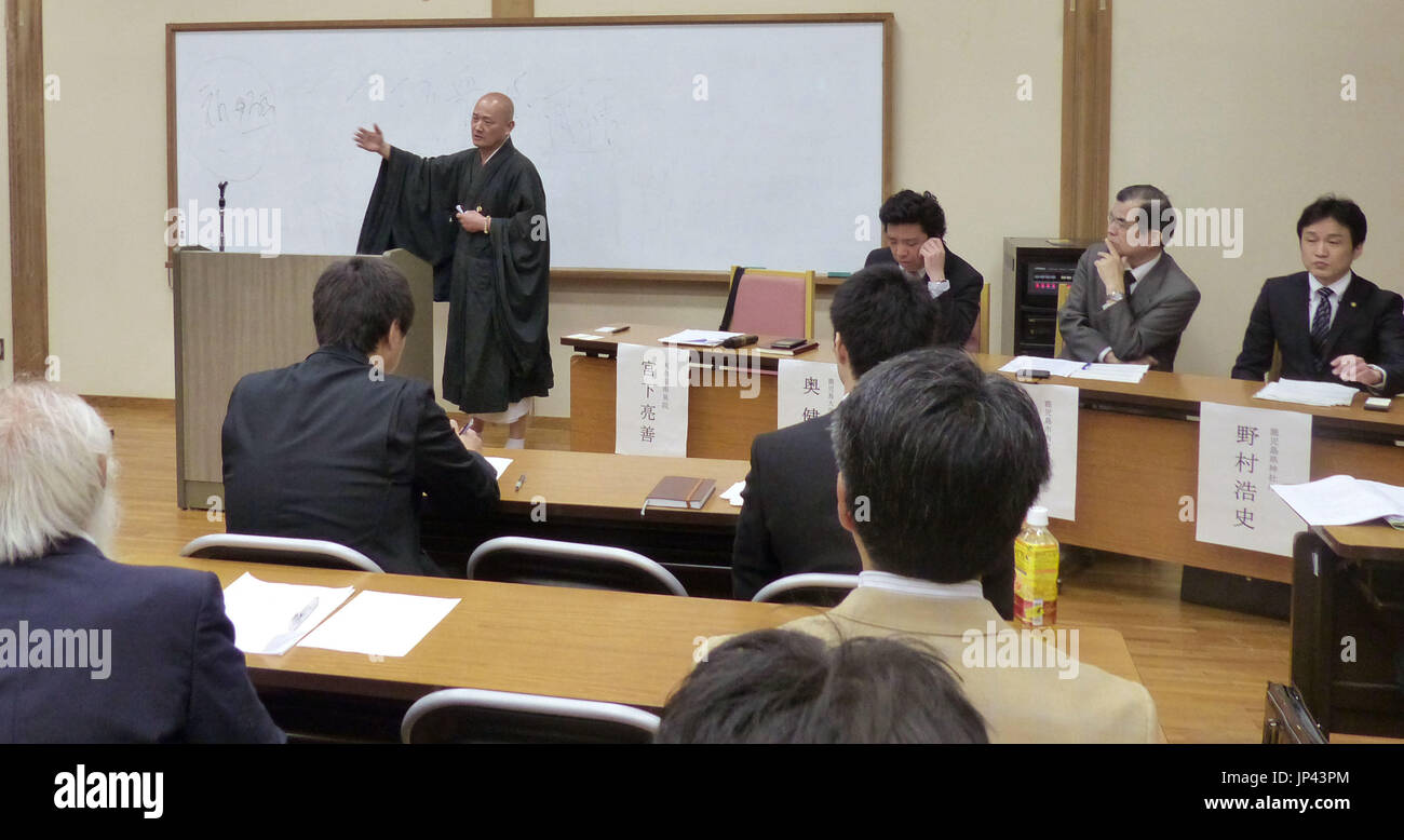TOKYO, Japan - Photo taken March 29, 2014, shows a member (standing) of ...