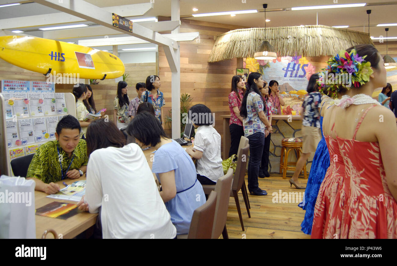 OSAKA, Japan - People visit Japanese travel agency H.I.S. Co.'s office ...