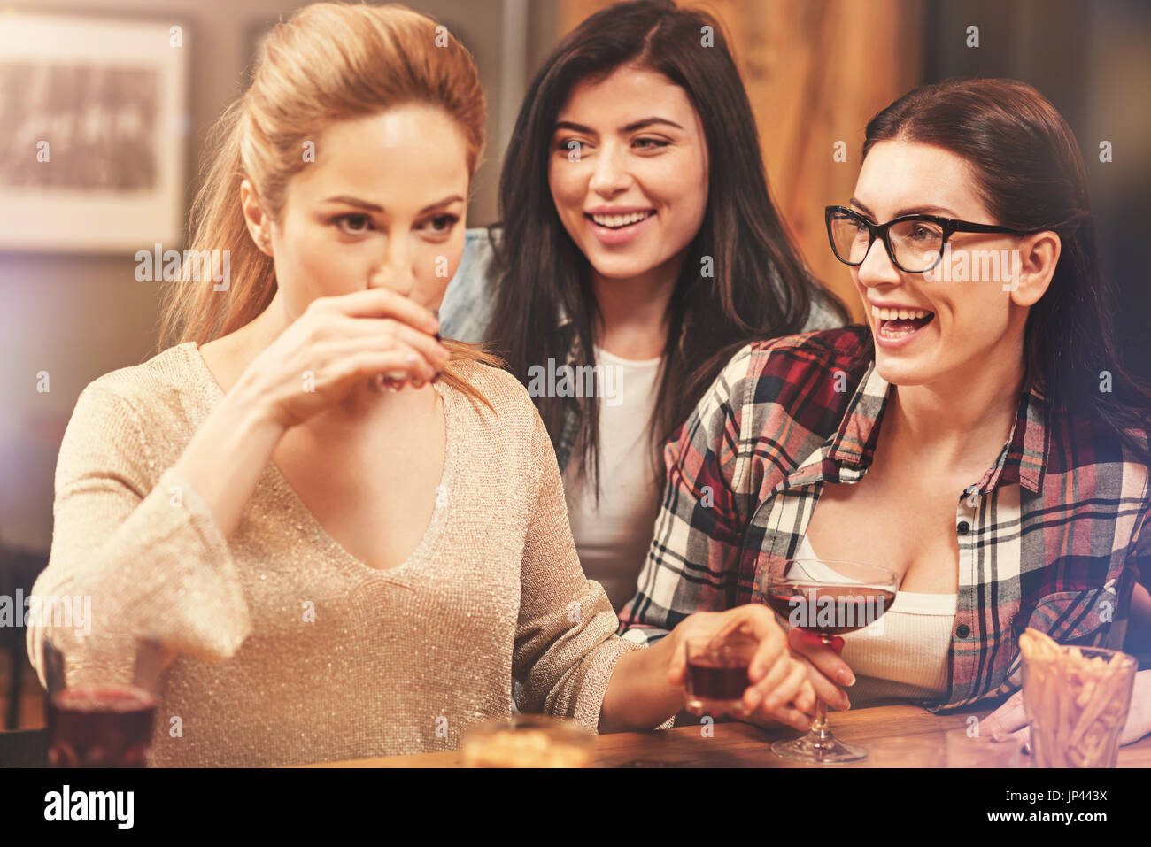 Serious female person drinking alcohol Stock Photo - Alamy