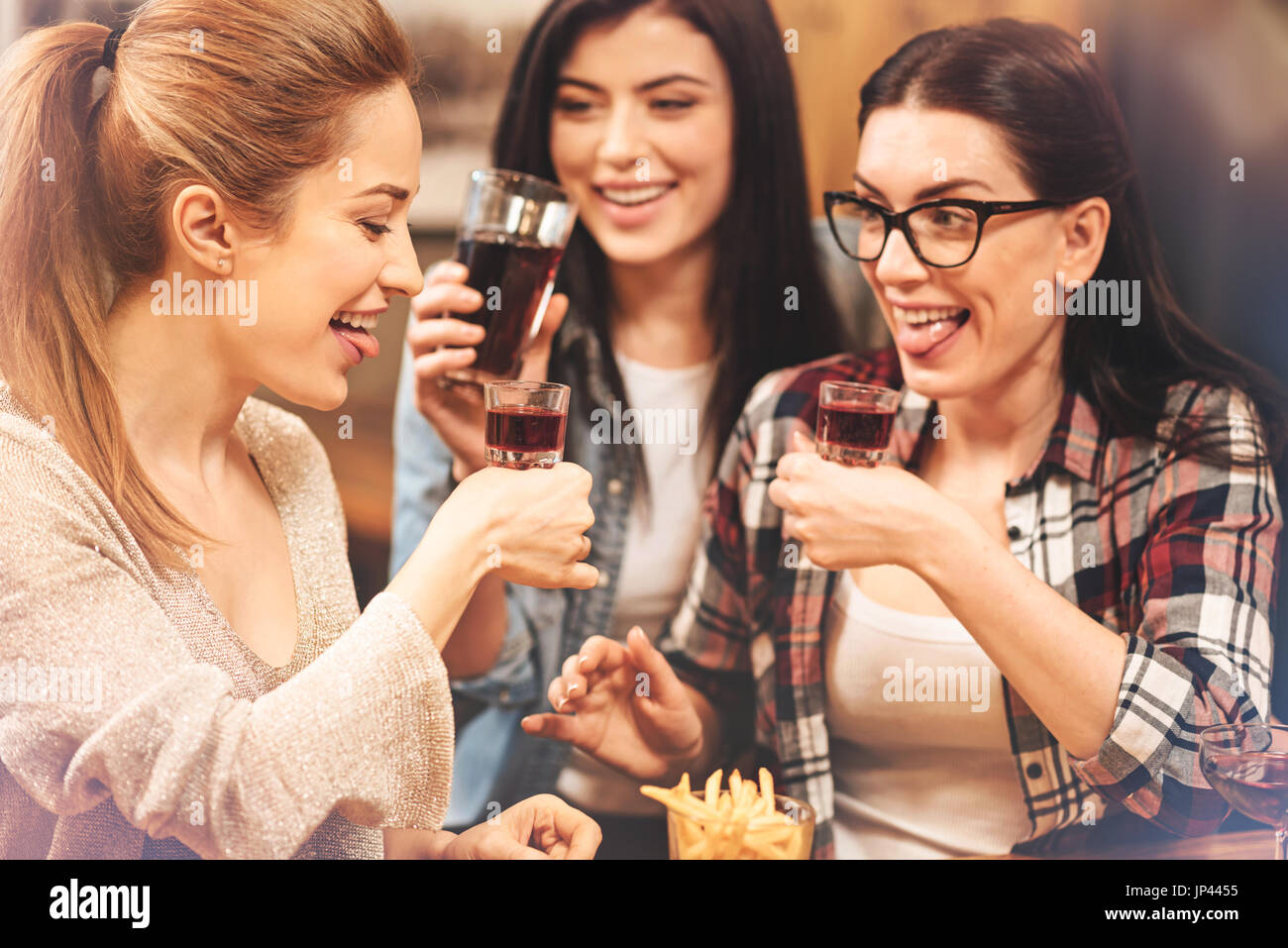 Positive friends enjoying their weekend Stock Photo - Alamy