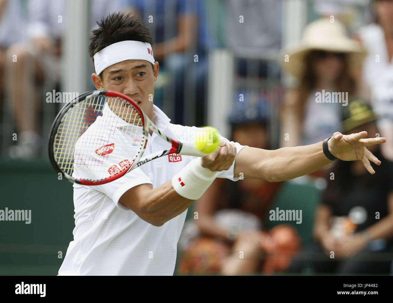 WIMBLEDON, Britain - Japanese tennis player Kei Nishikori hits a return ...