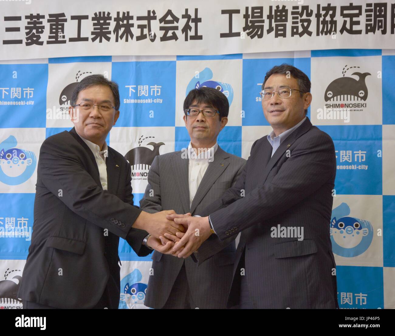 SHIMONOSEKI, Japan - Toru Kitamura (L), head of Mitsubishi Heavy ...