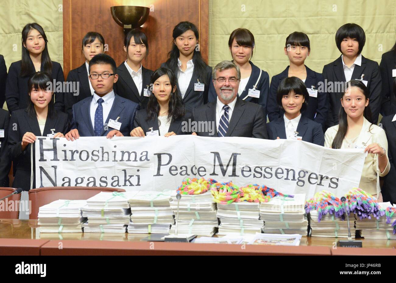GENEVA, Switzerland - A group of Japanese high school students serving ...